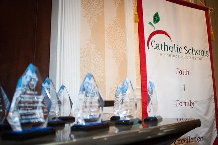 School employees celebrate the ‘faith, knowledge and service’ of ...