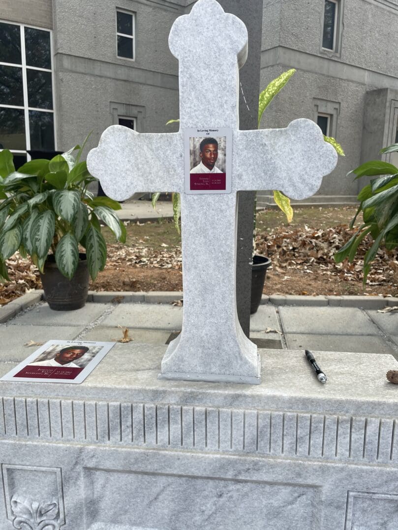 Cross memorial at Lyke House Newman Center honors slain student ...